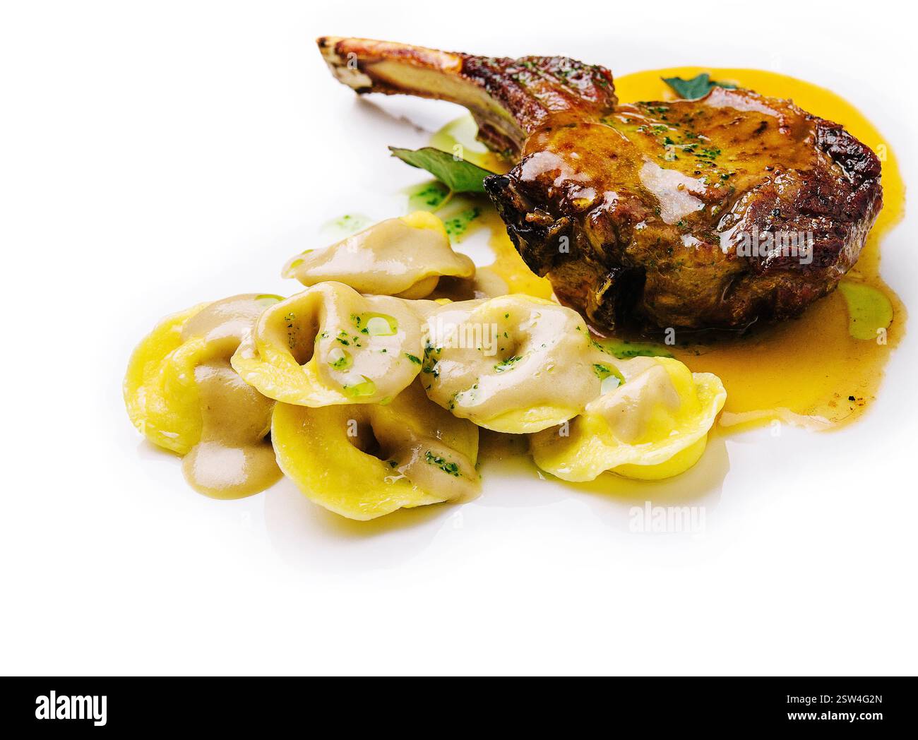 Tomahawk steak and ravioli on plate hi-res stock photography and images ...