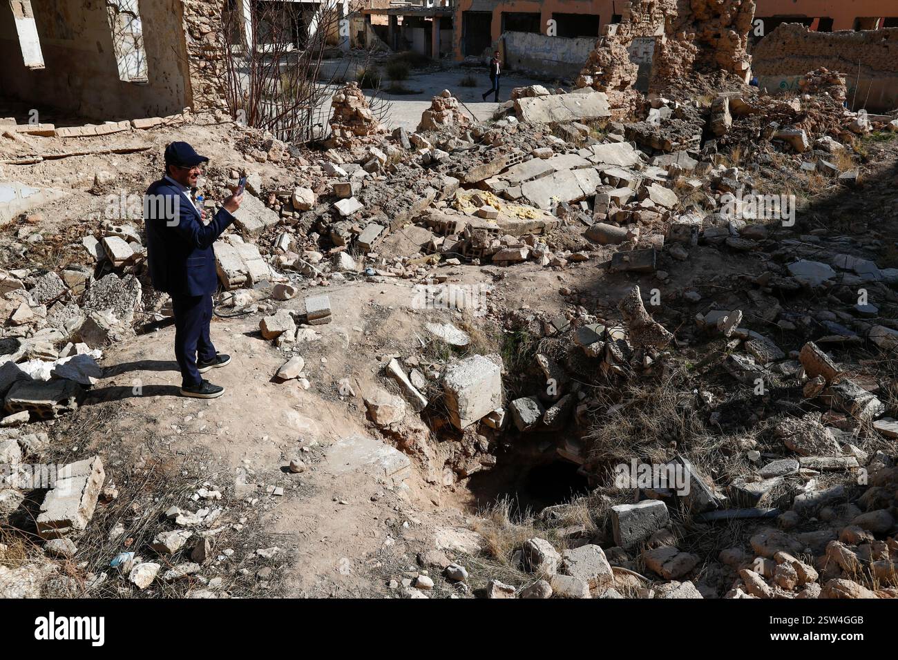 Syrian-American Henry Hamra takes pictures at a synagogue destroyed ...