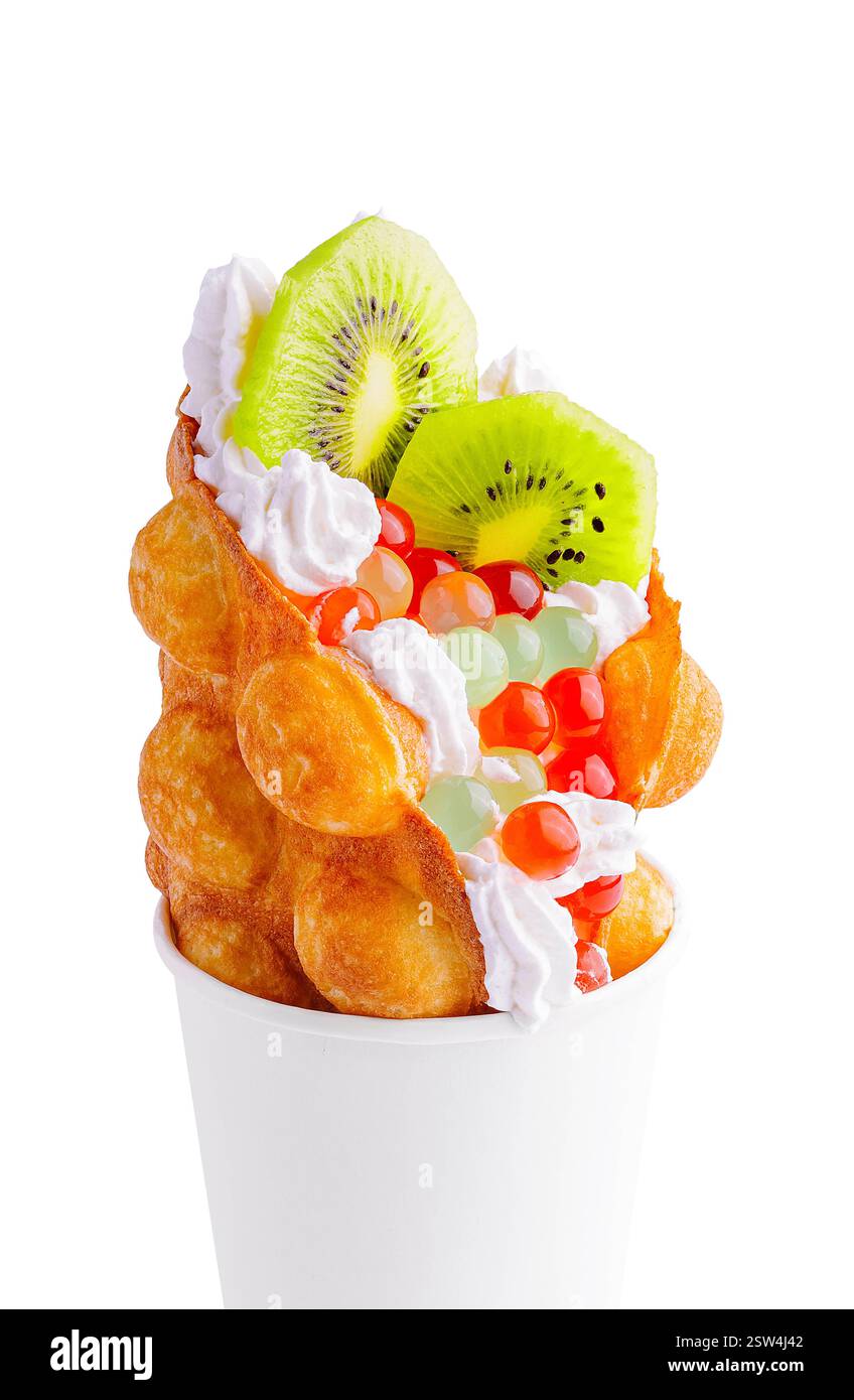 Bubble Waffle with kiwi, bubble tea and whipped cream Stock Photo - Alamy