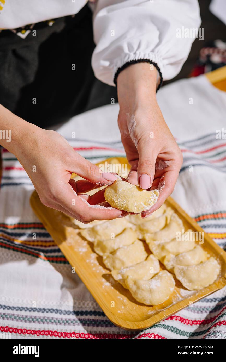 Traditional dumpling preparation by hands Stock Photo - Alamy