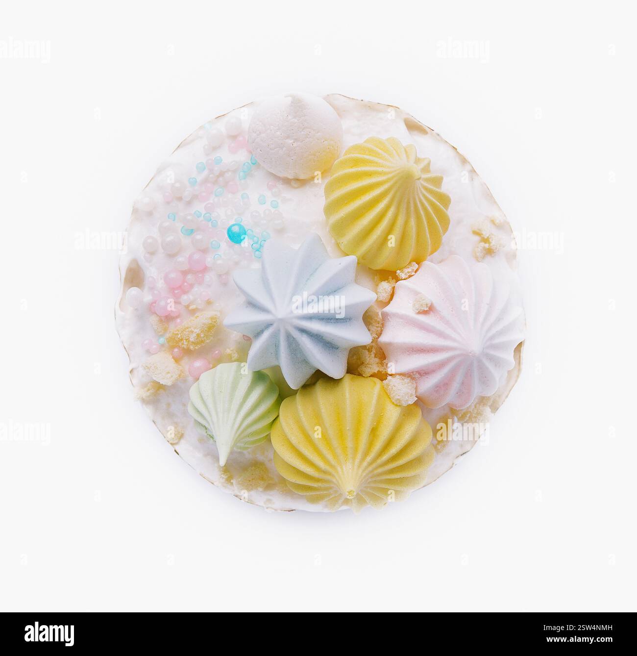 Colorful meringue topped cake on white background Stock Photo - Alamy