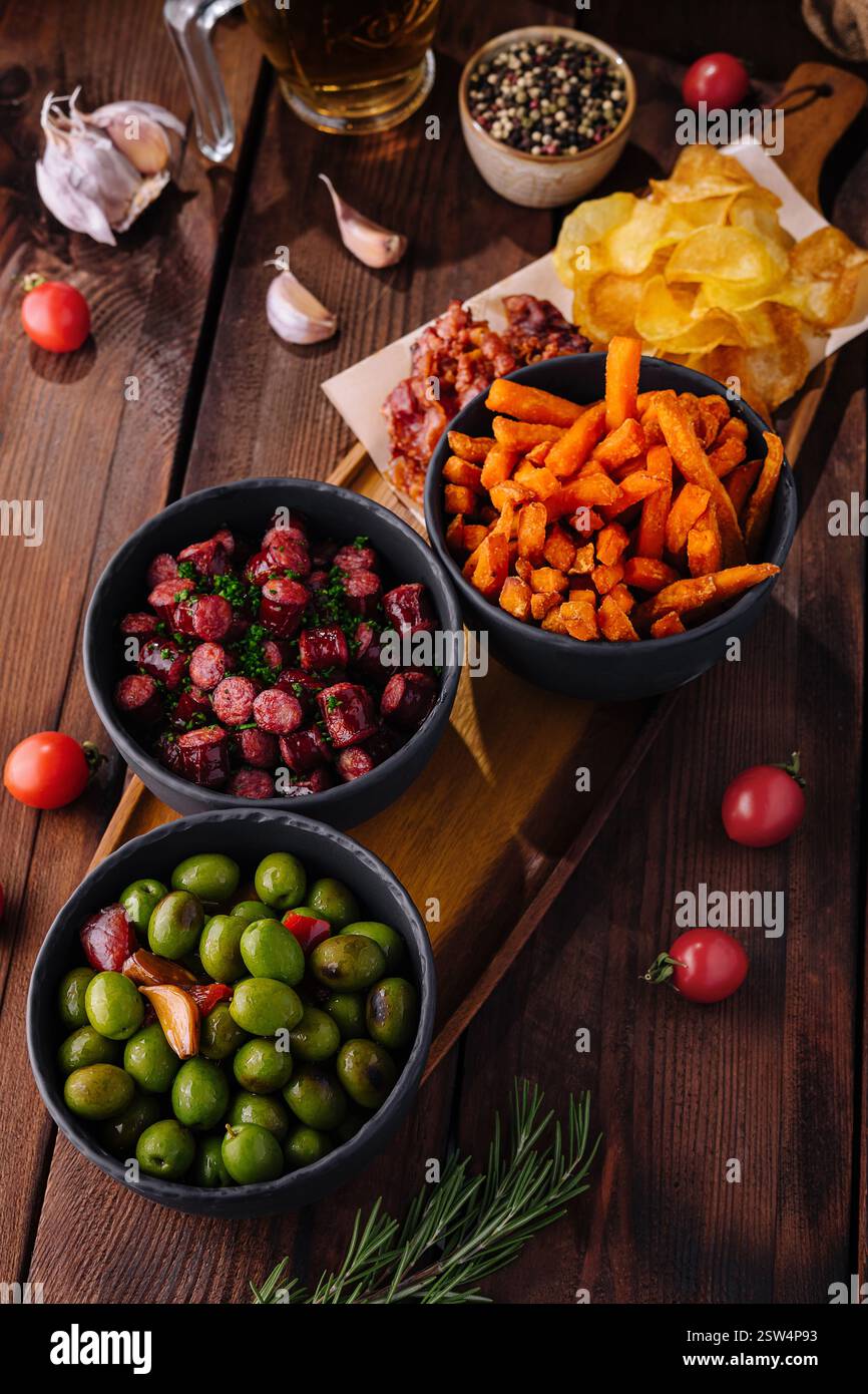 Assorted tapas platter with olives and snacks Stock Photo - Alamy