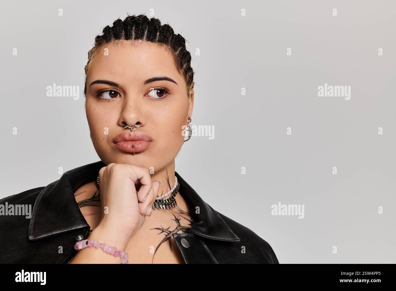 Young woman showcases her unique fashion sense with bold tattoos and a ...