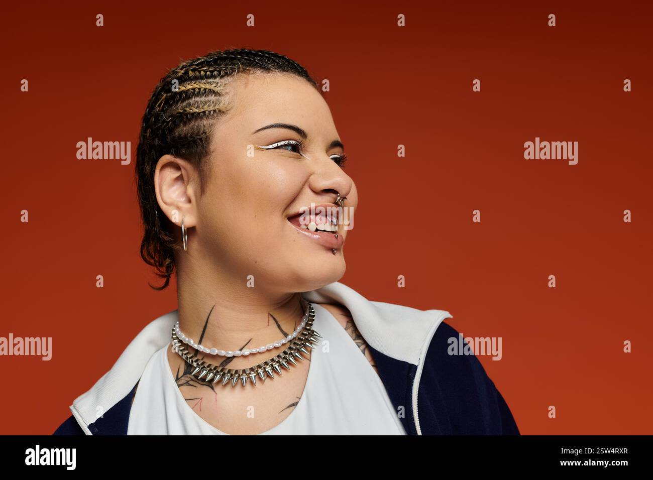 A young woman beams as she flaunts her unique fashion and accessories ...