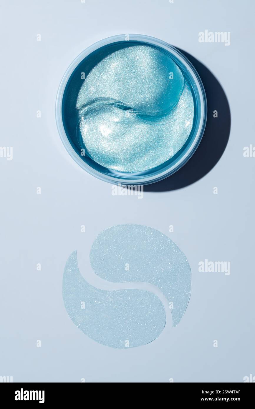 open jar with collagen anti-ageing patches for the eyes and face. Close ...