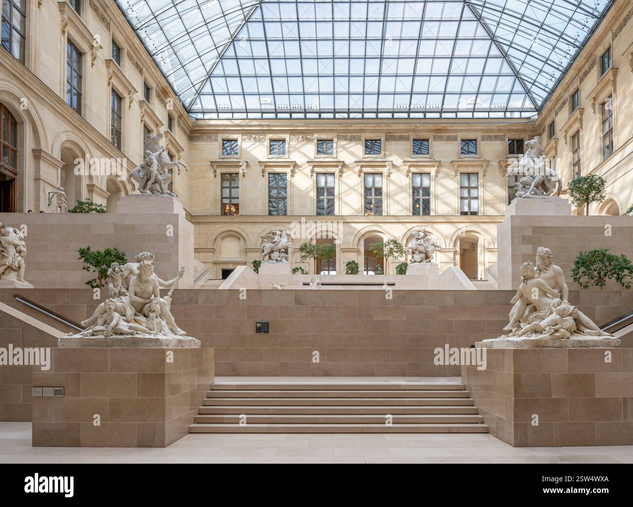 Paris, France - 02 23 2022: Le Louvre Museum. Statues, trees on ...