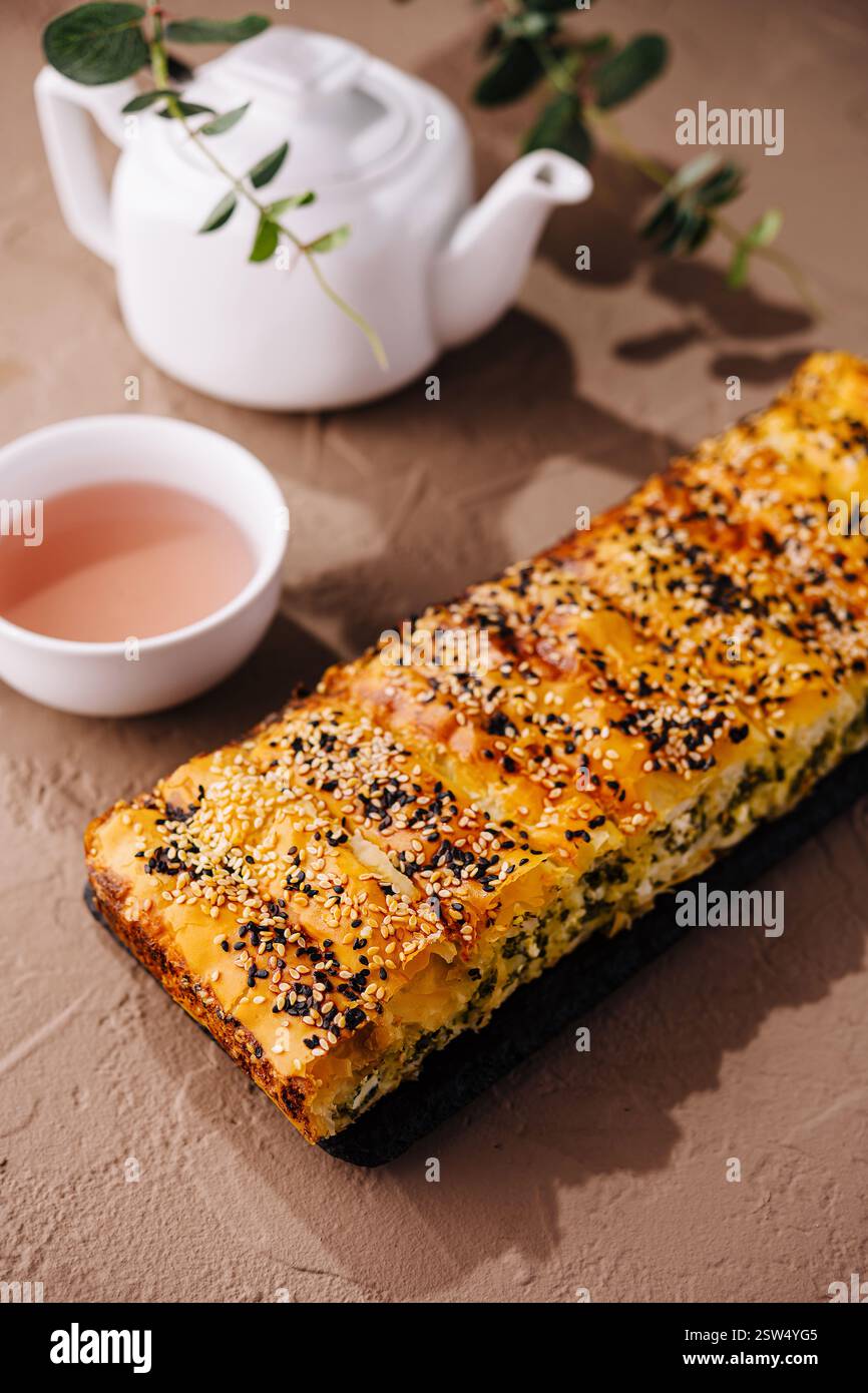 Artisanal sesame seed bread loaf with tea Stock Photo - Alamy