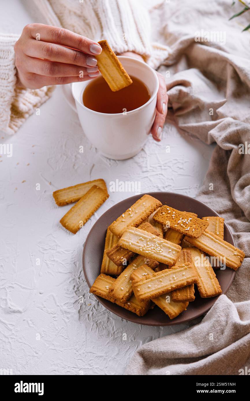 Cozy tea time with cookies Stock Photo - Alamy