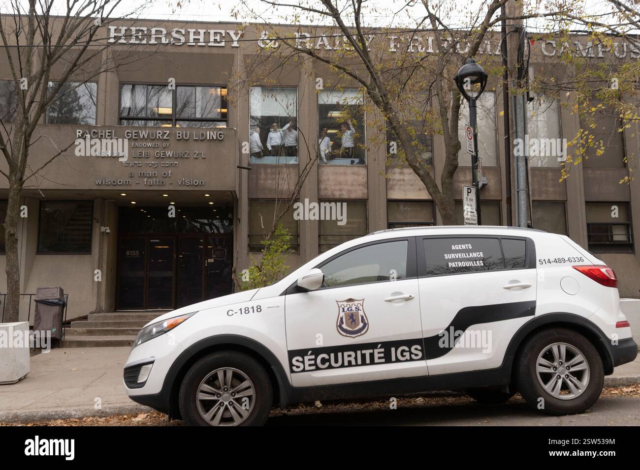A security vehicle sits outside the Yeshiva Gedolah, a Jewish school ...