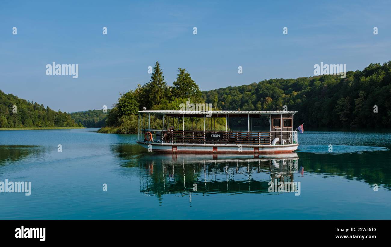 Discover the serene beauty of Plitvice Lakes with a tranquil boat ride ...