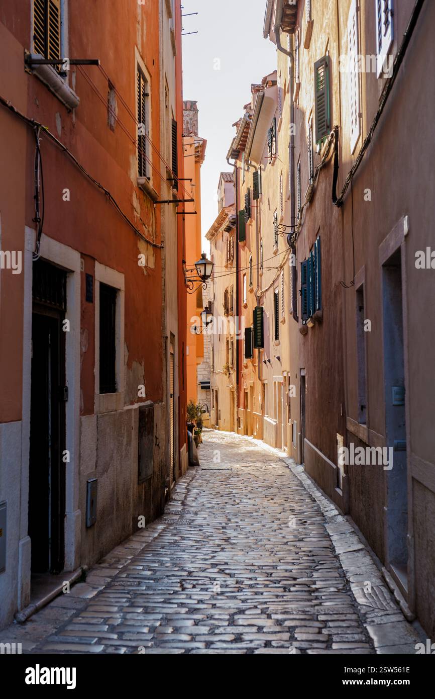 Wander through a narrow cobblestone alley in Rovinj, Croatia, where ...