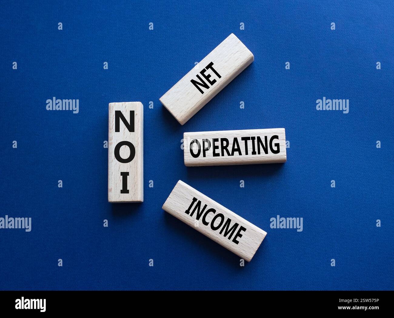 NOI - Net Operating Income symbol. Concept word NOI on wooden cubes ...