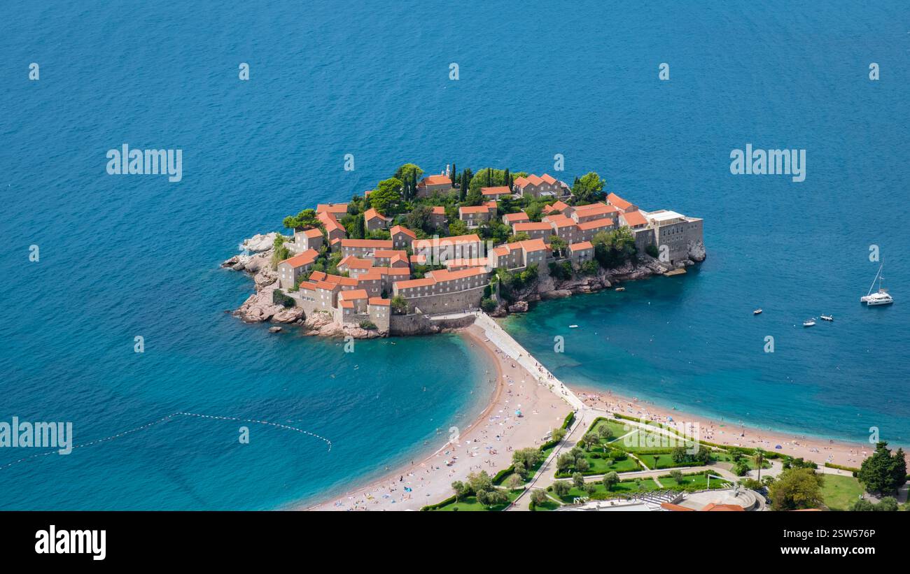 A captivating view of Sveti Stefan reveals its stunning red-roofed ...