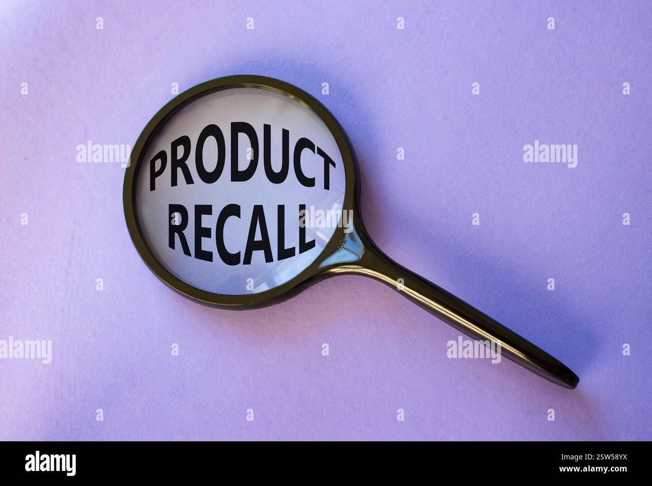 Product recall symbol. Concept words Product recall on magnifying glass. Beautiful purple ...