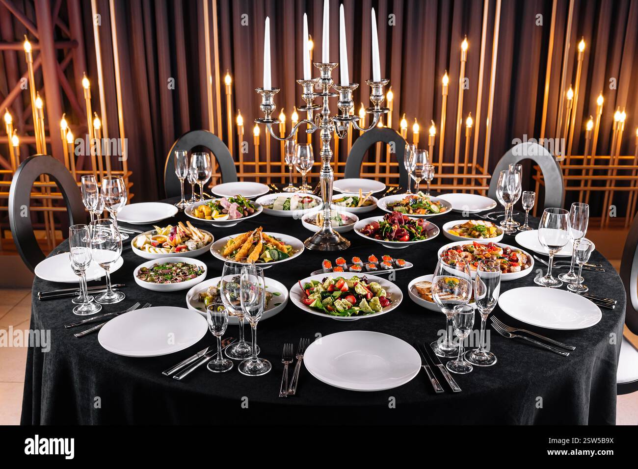 Elegant dining table set for gourmet banquet Stock Photo - Alamy
