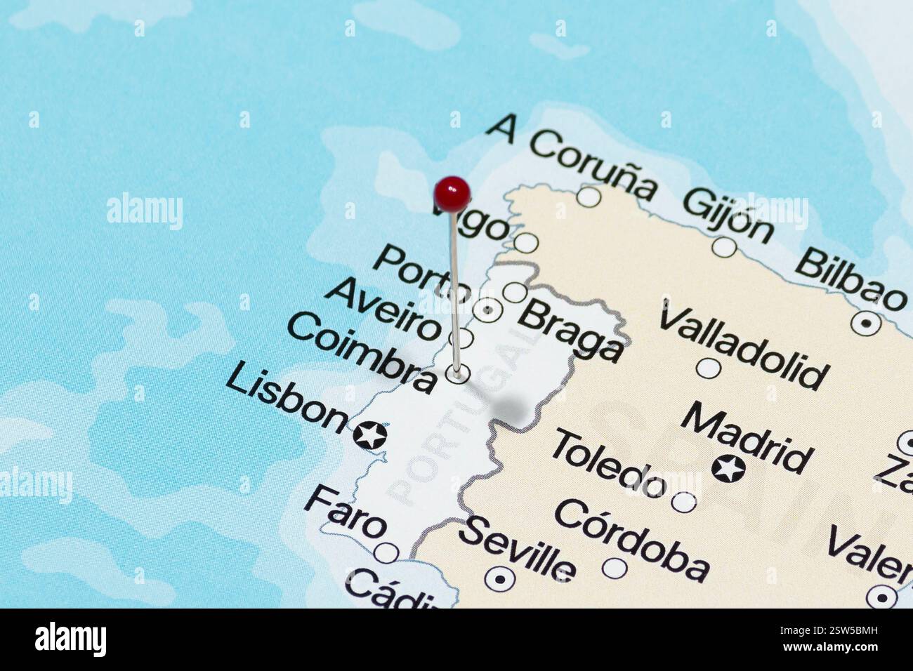 Macro photo of a red pin needle into coimbra city of portugal political ...