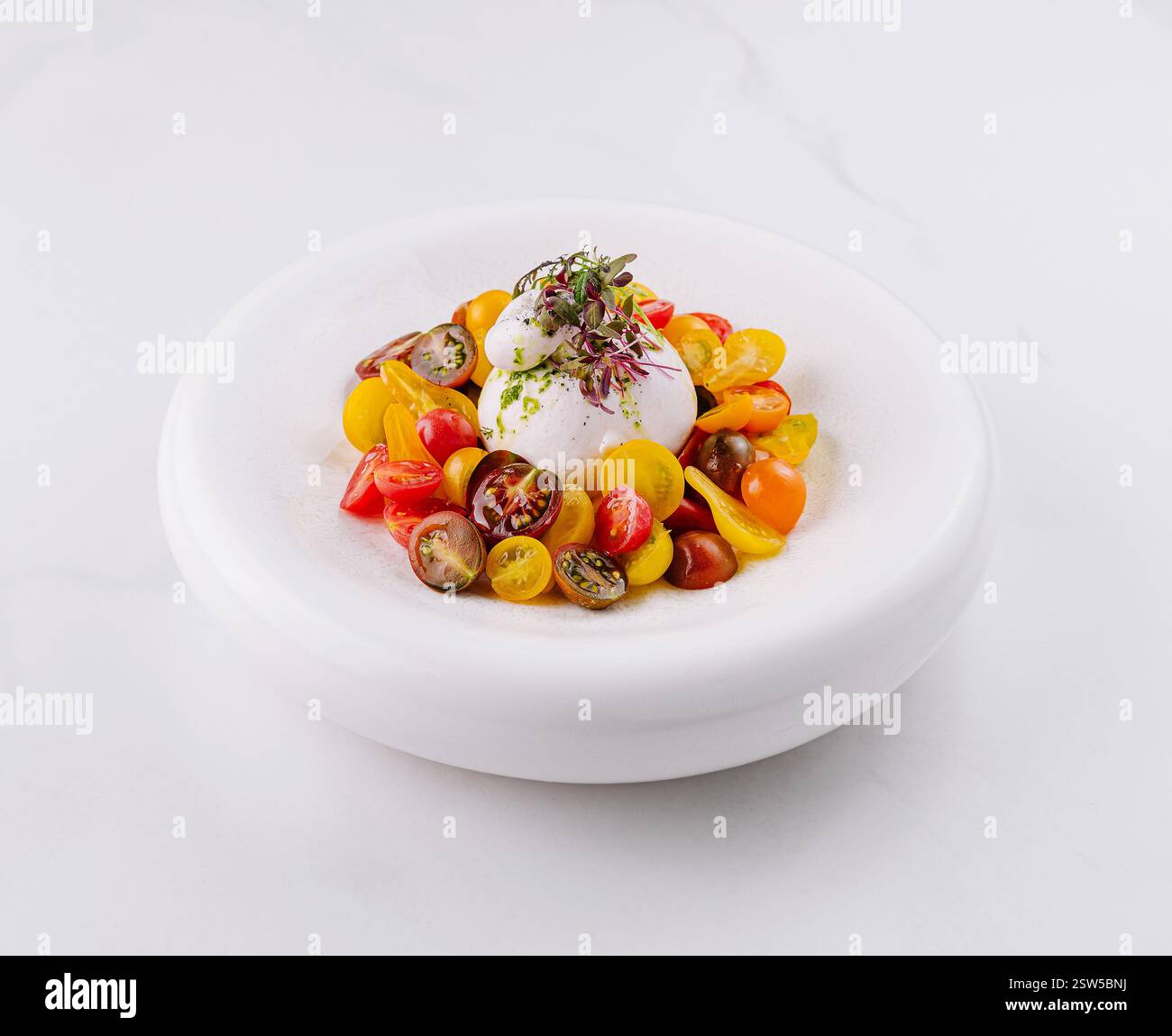 Gourmet burrata cheese salad on white plate Stock Photo - Alamy