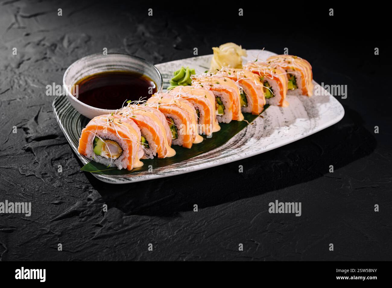 Fresh salmon sushi roll platter with dipping sauce Stock Photo - Alamy