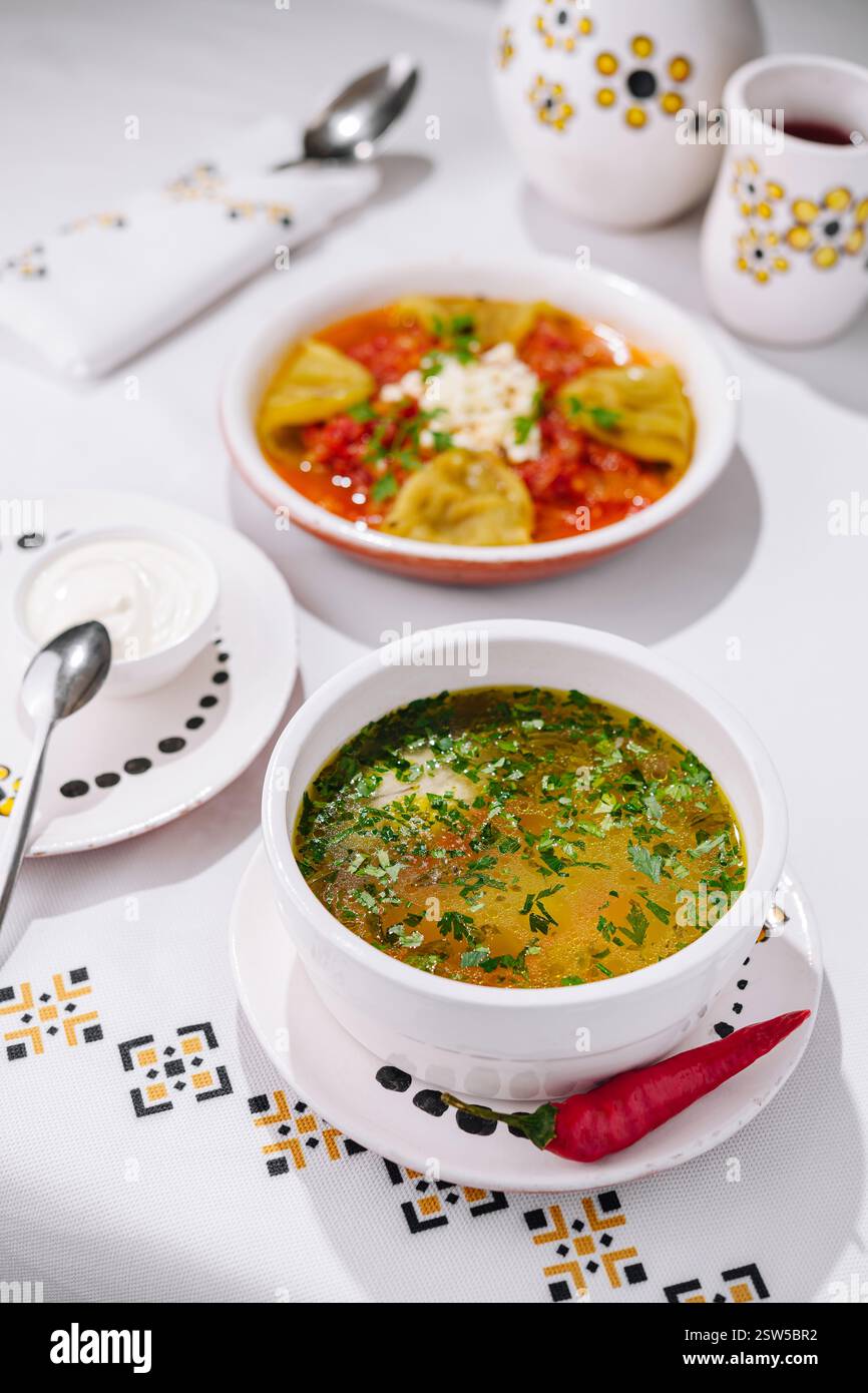 Traditional soup and pasta on elegant table setting Stock Photo - Alamy