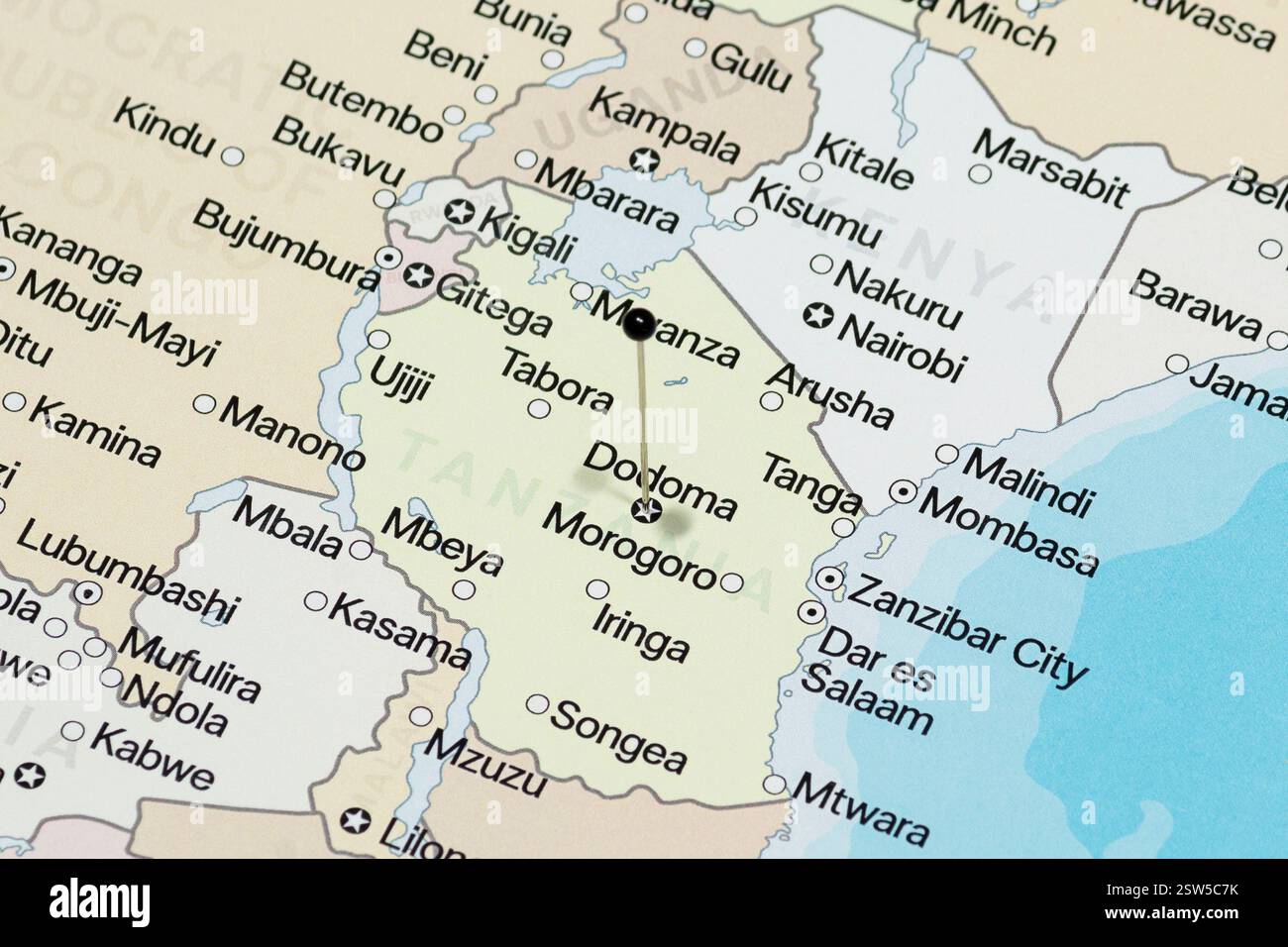 black pin needle into dodoma city of tanzania map Stock Photo - Alamy