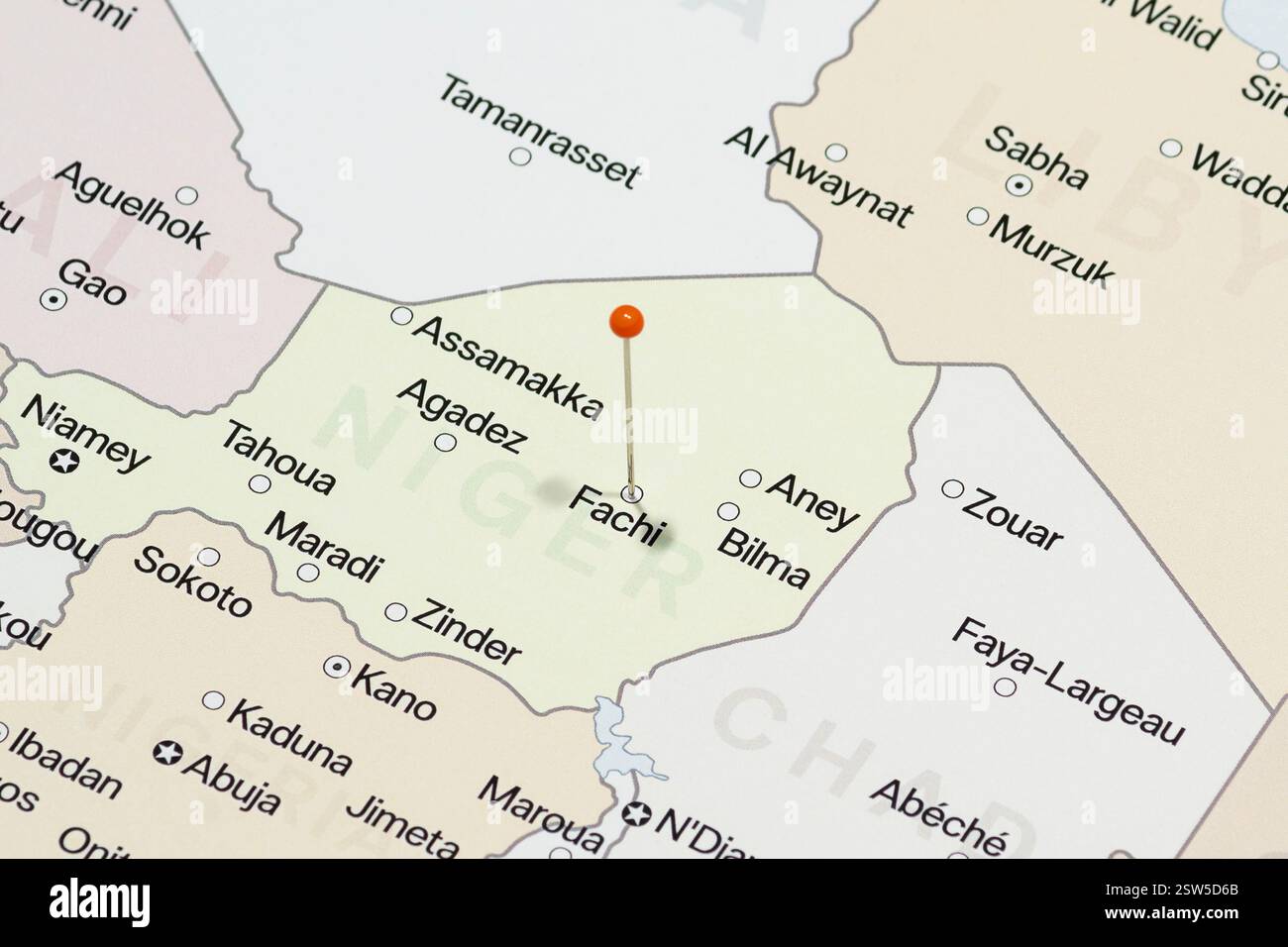 an orange pin needle into fachi city of niger political map Stock Photo ...