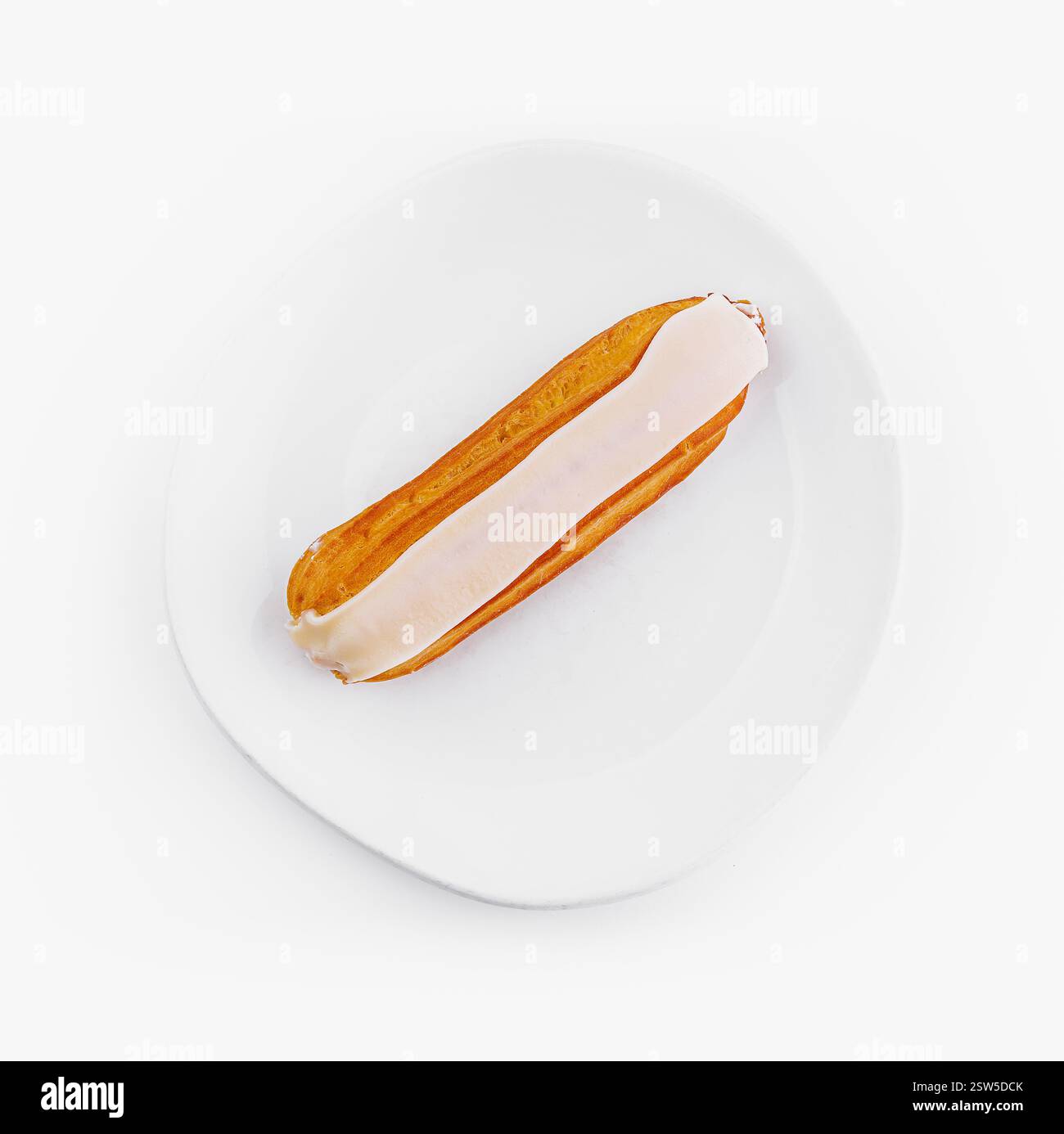 High-angle view of a delicious eclair with creamy icing, perfectly ...