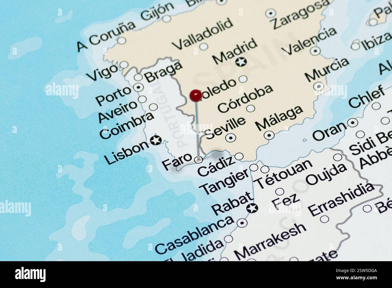 red pin needle into faro city of portugal political map Stock Photo - Alamy