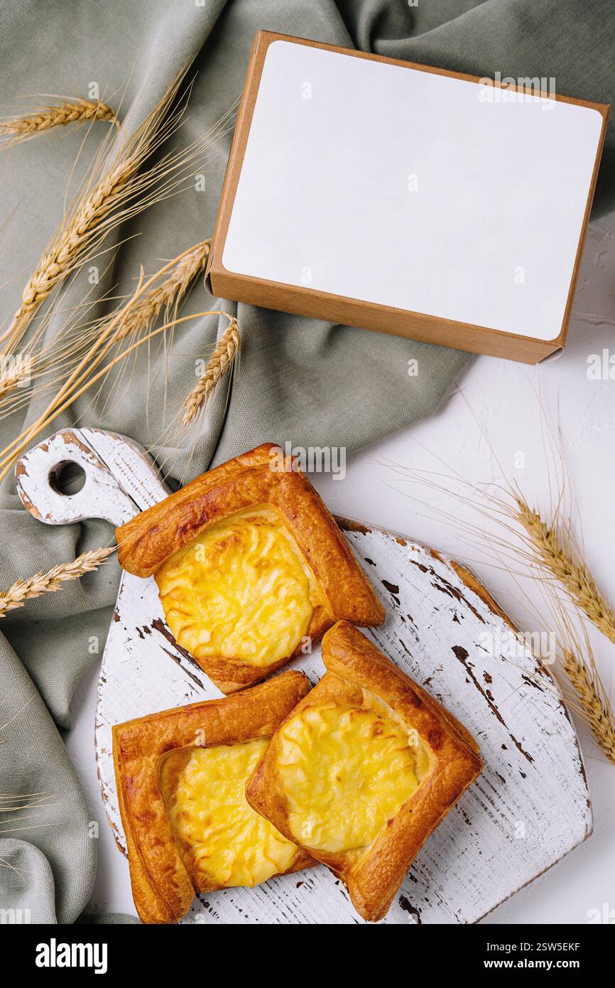 Blank box with homemade cheese tarts Stock Photo - Alamy