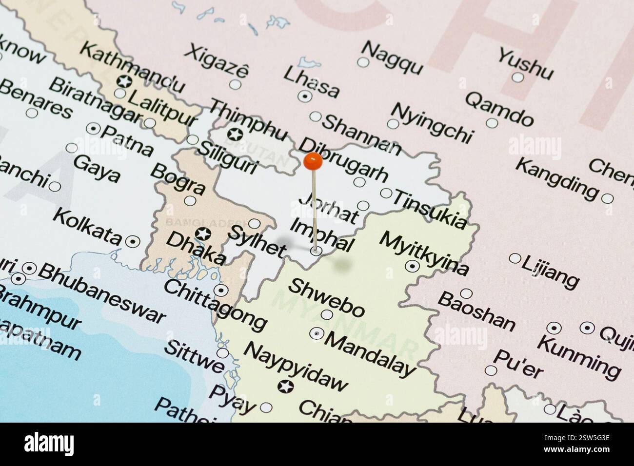 an orange pin needle into imphal city of india political map Stock ...