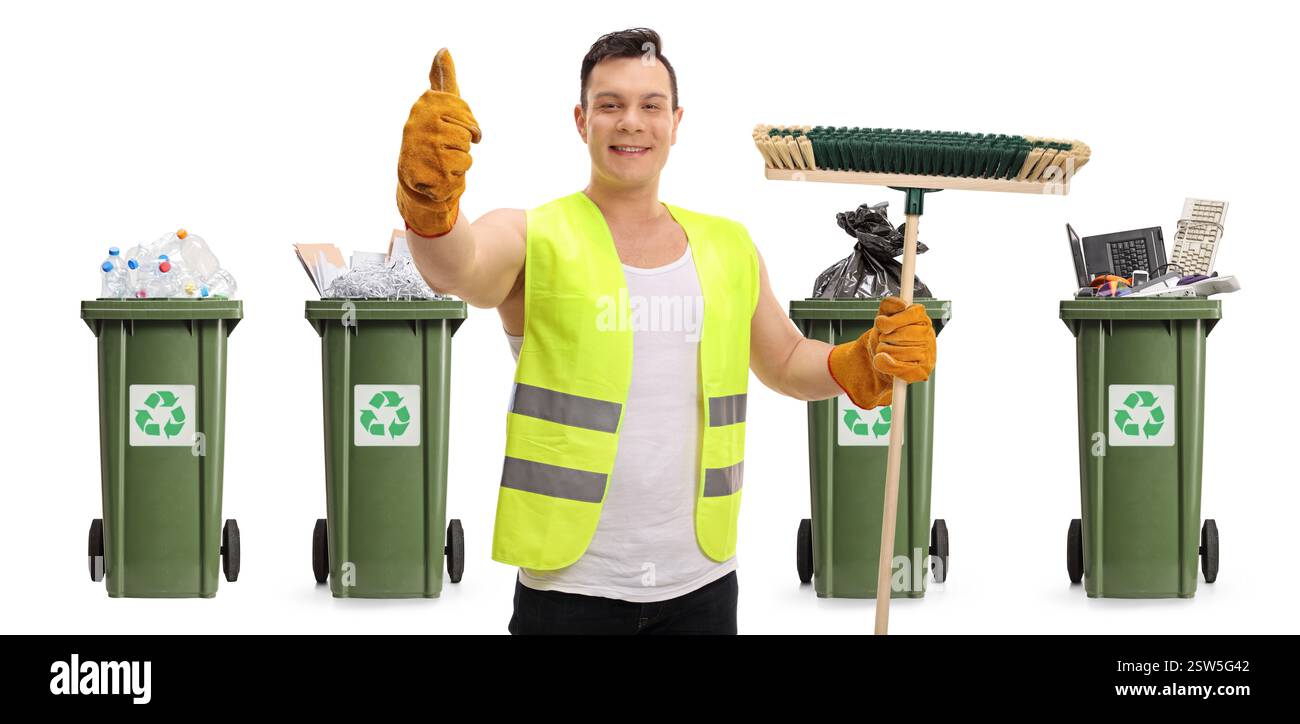 Waste collector holding a broom and making a thumb up sign in front of ...