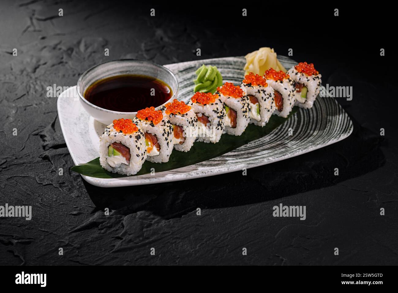 Elegant sushi roll platter with caviar and soy sauce Stock Photo - Alamy