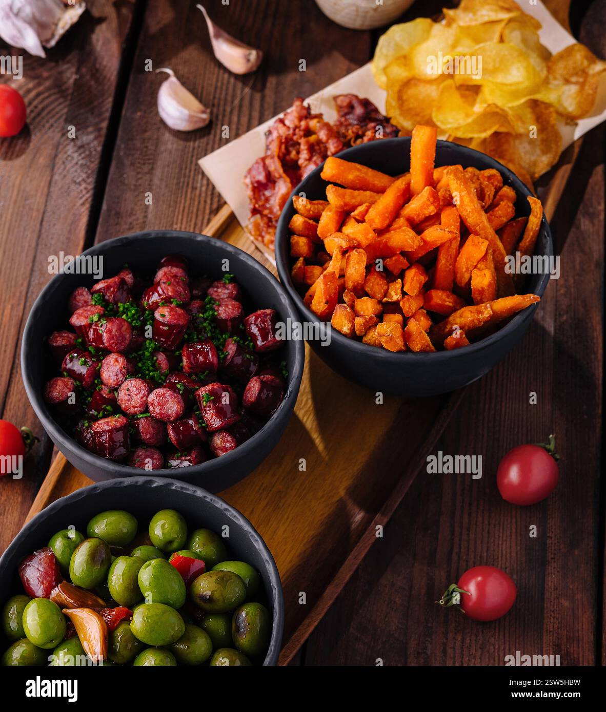 Assorted tapas platter with olives and snacks Stock Photo - Alamy