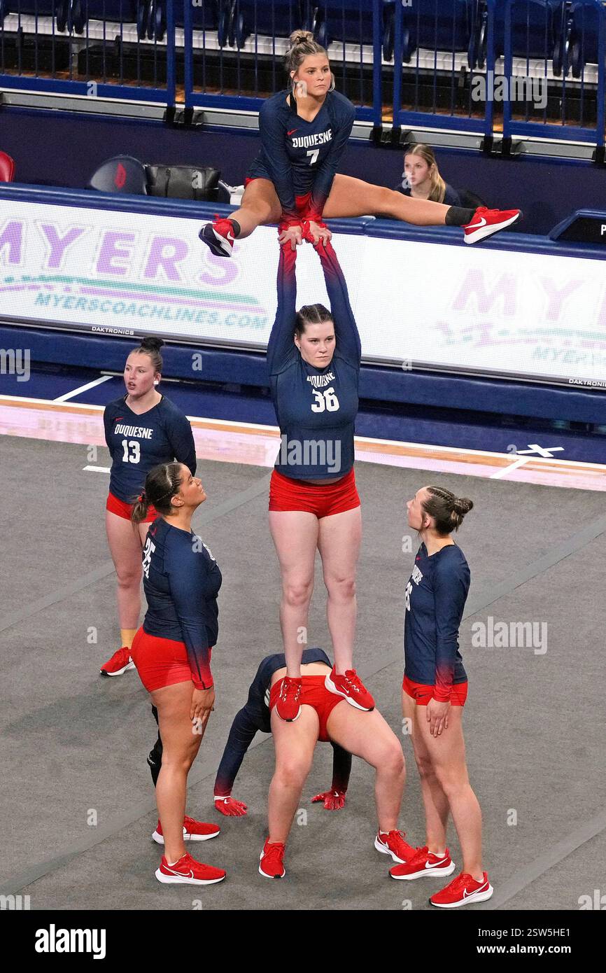 Duquesne's acrobatics and tumbling team members McKenna Fisher, bottom ...