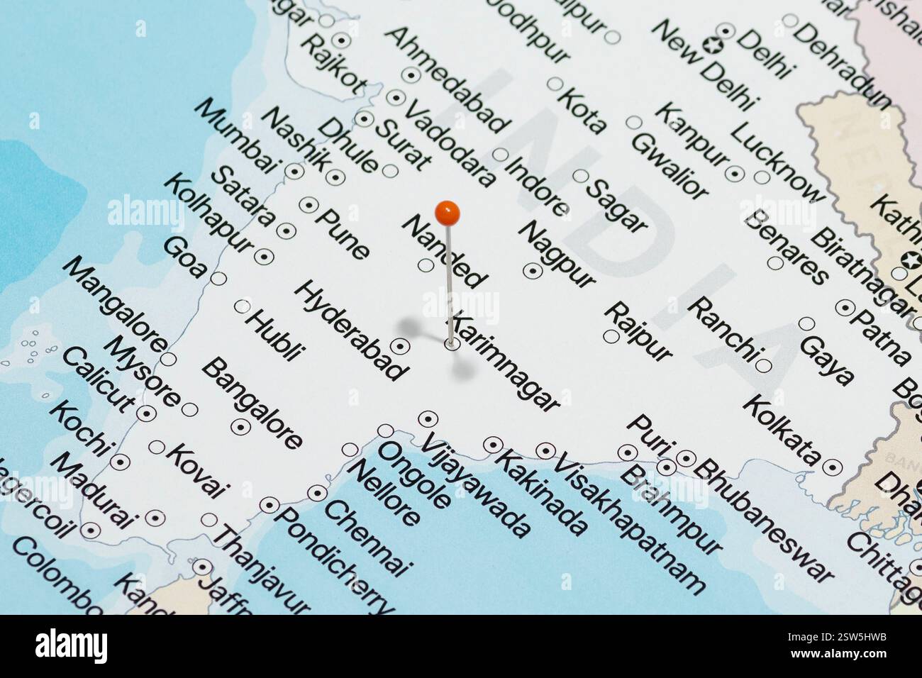 an orange pin needle into karimnagar city of india political map Stock ...