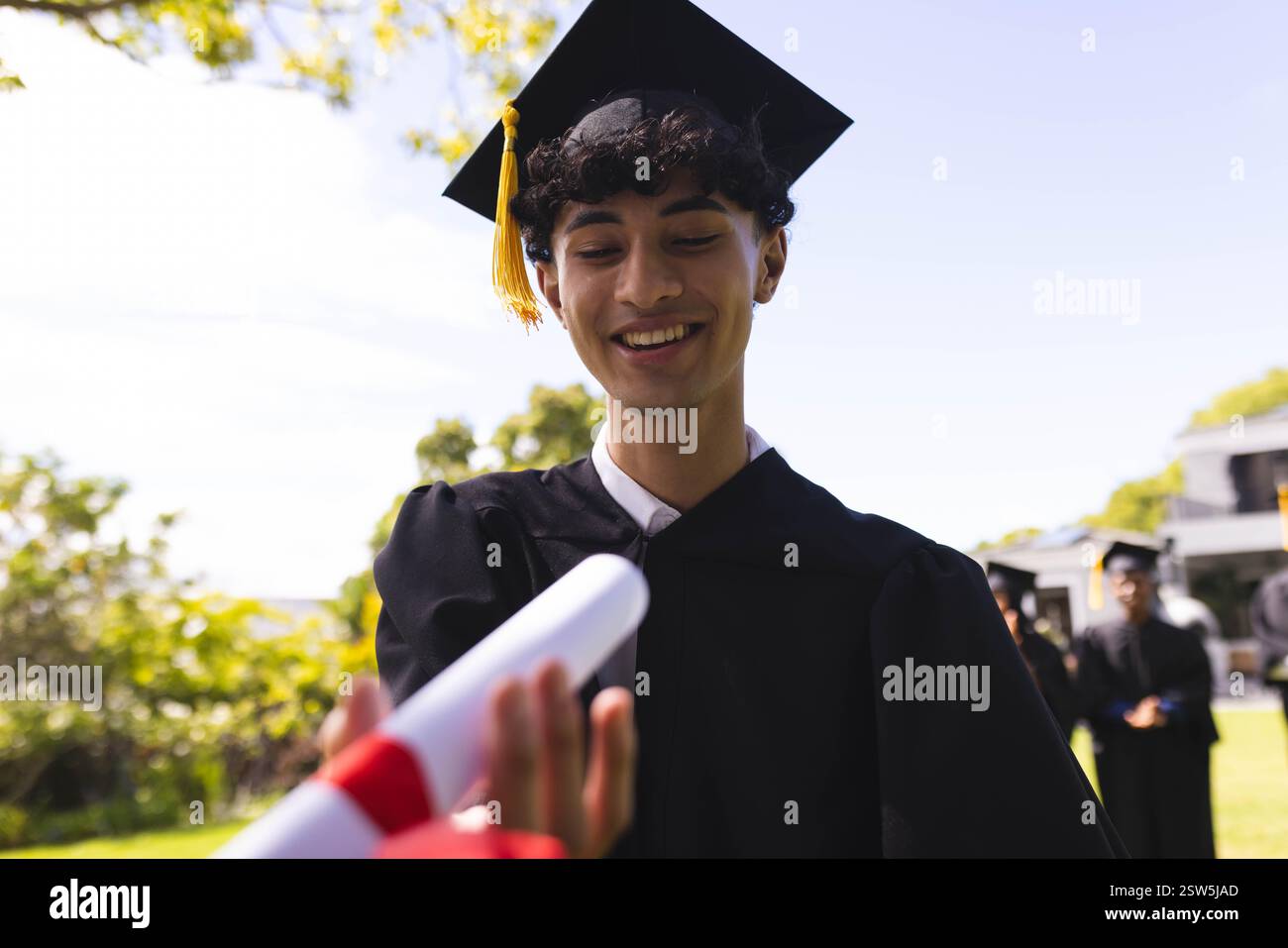 Receiving diploma hi-res stock photography and images - Alamy