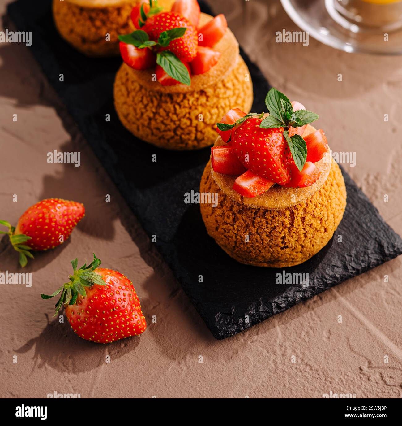 Fresh strawberry tartlets on elegant slate board Stock Photo - Alamy