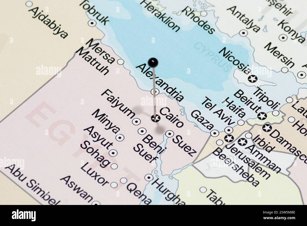 black pin needle into cairo city of egypt political map Stock Photo - Alamy
