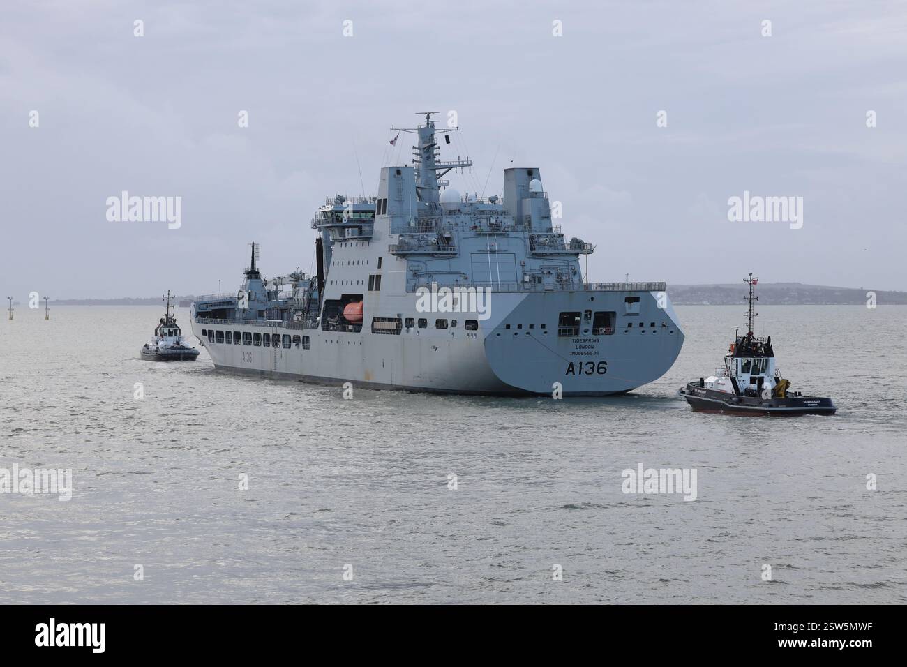 Naval Base tugs escort the Royal Fleet Auxiliary replenishment tanker ...
