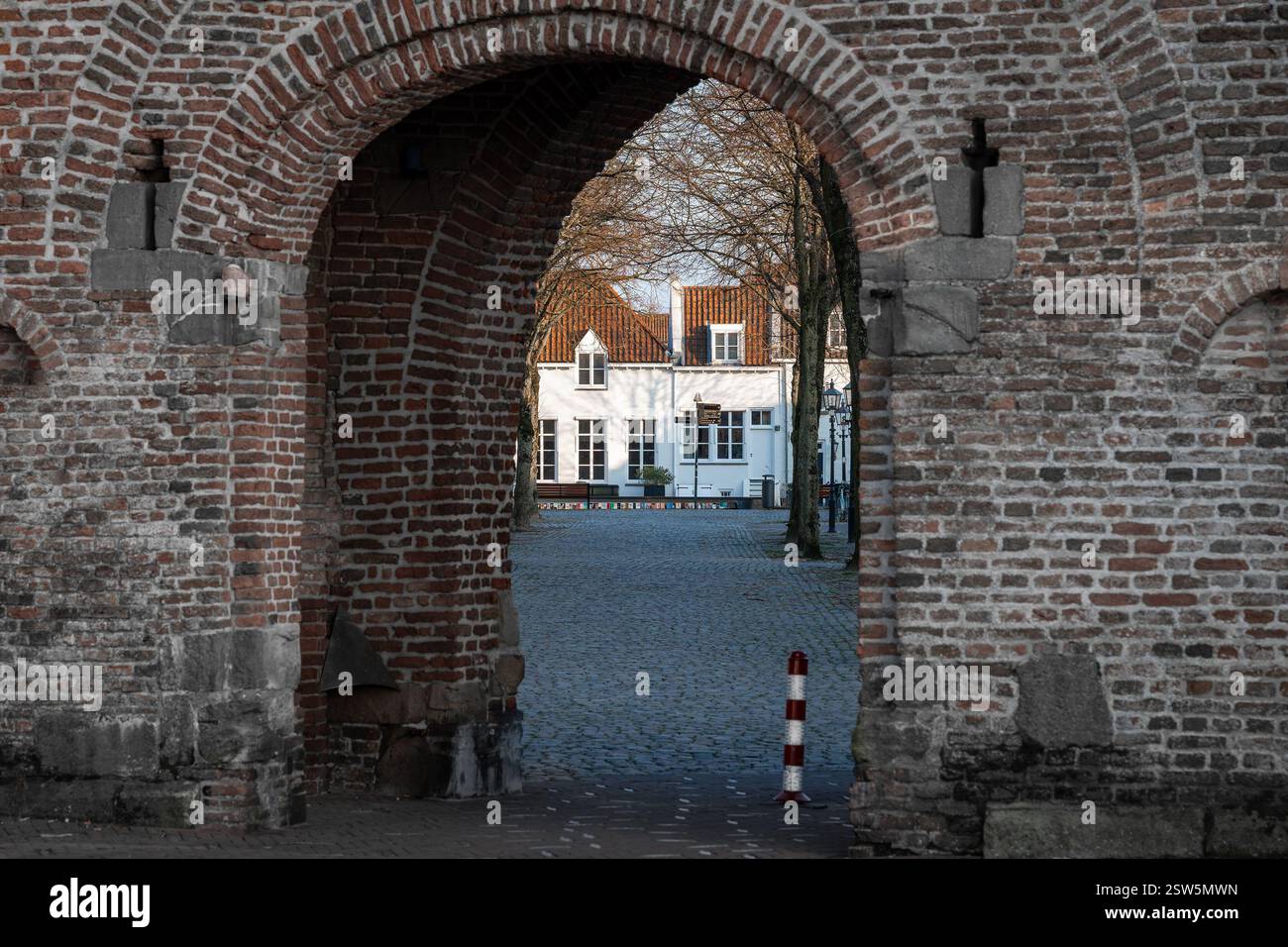 Peek through the arch of Vischpoort, the 14th century city gate in ...