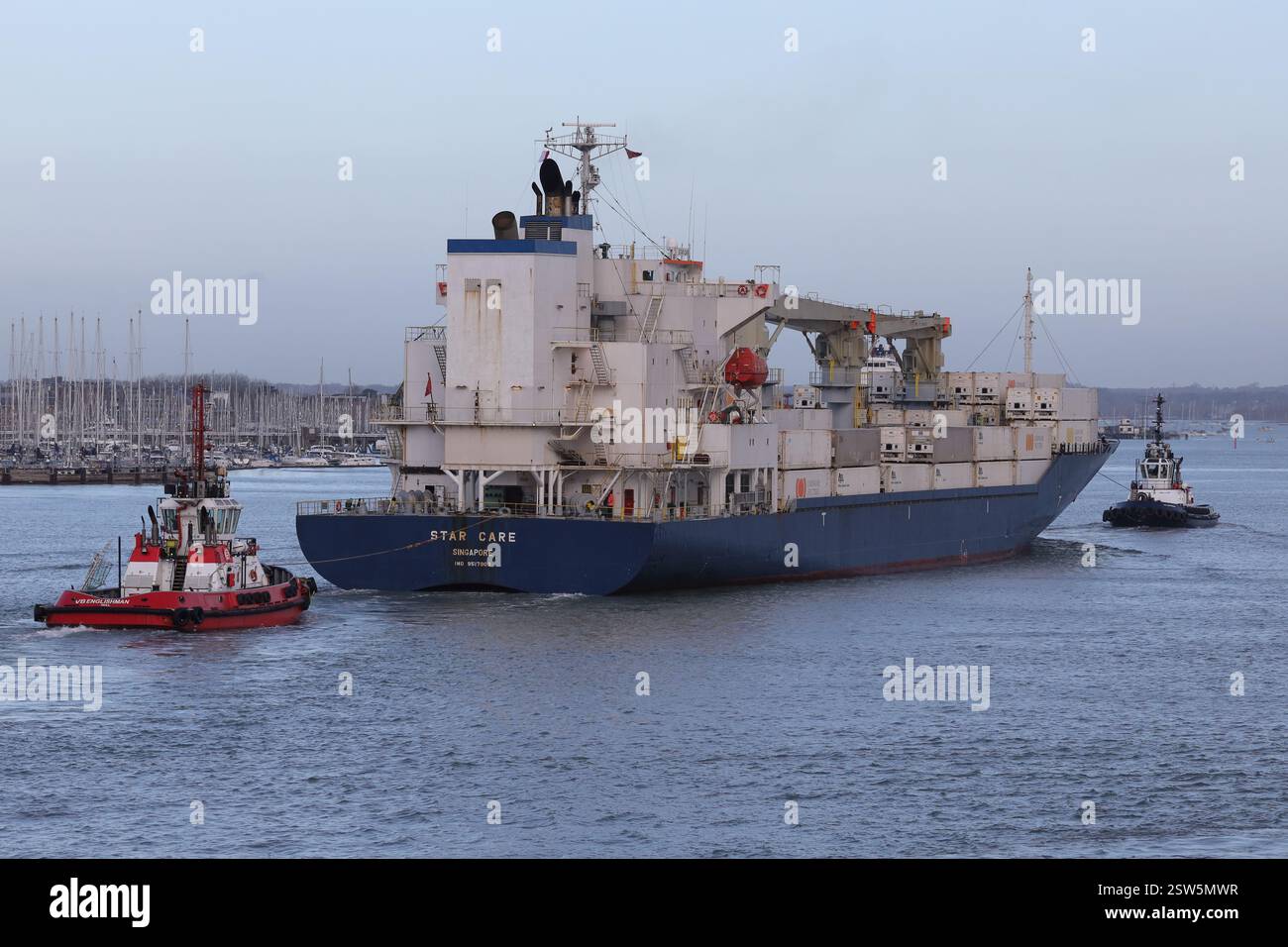 The tugs ENGLISHMAN and SCOTSMAN escort the refrigerated cargo ship MV ...