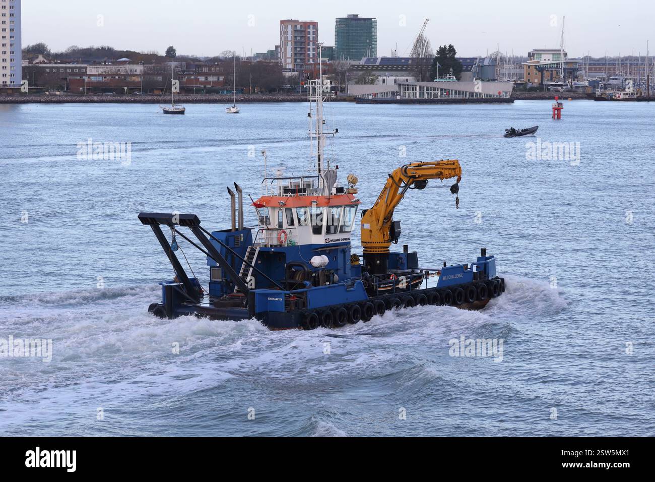 The multi purpose utility workboat WILLCHALLENGE heading up harbour ...
