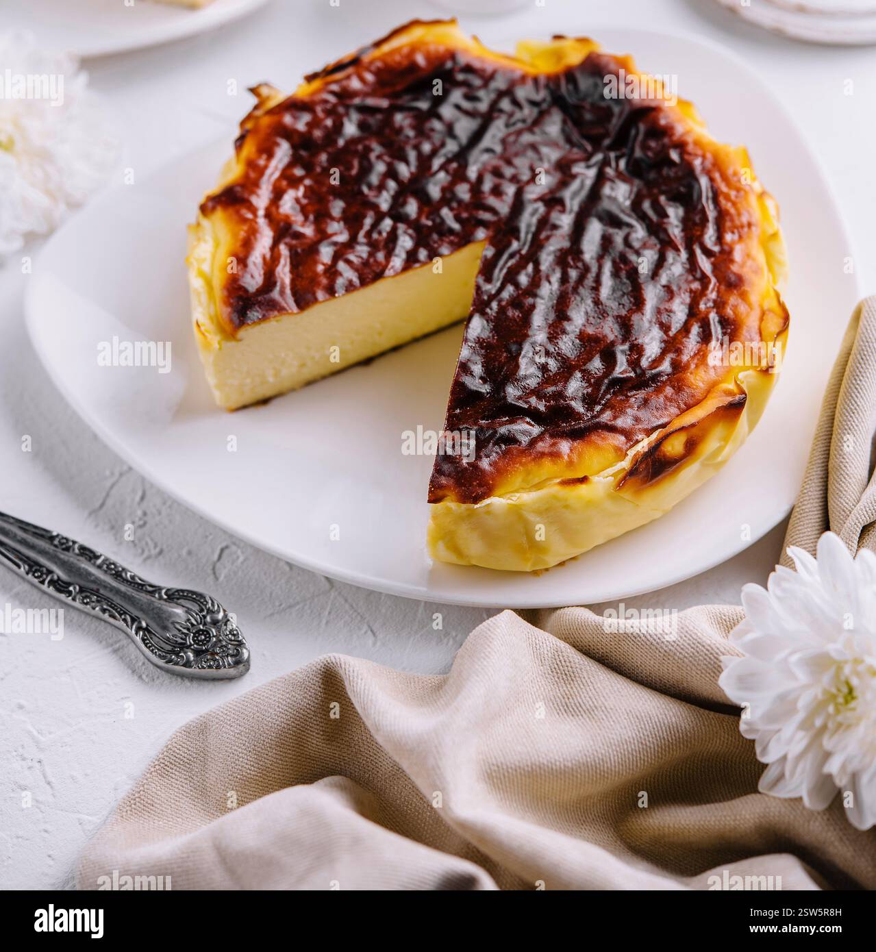 Traditional basque burnt san sebastian cheesecake slice on elegant ...