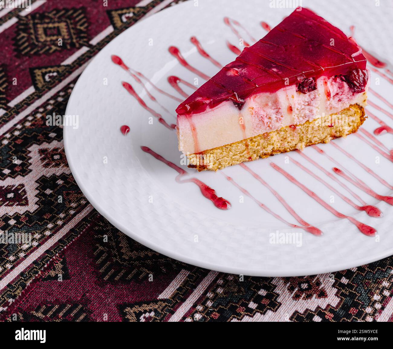 Delicious raspberry cheesecake slice on plate Stock Photo - Alamy