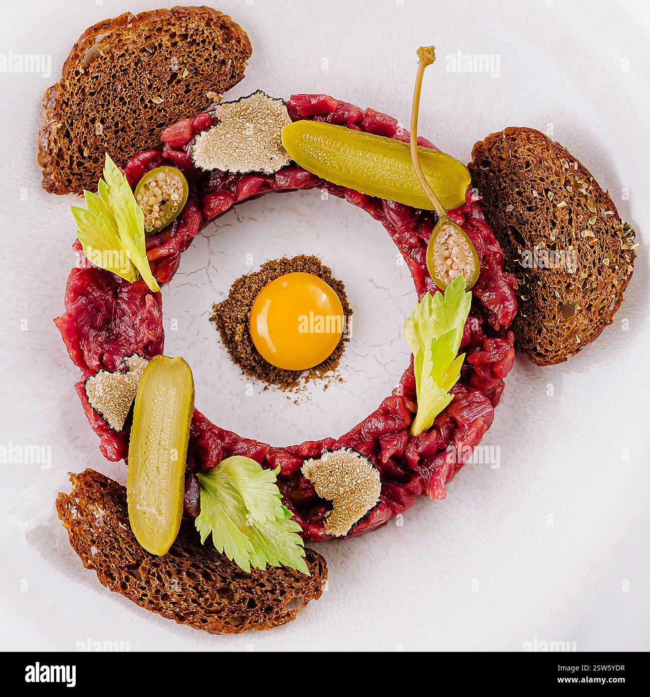 Gourmet steak tartare with quail egg Stock Photo - Alamy