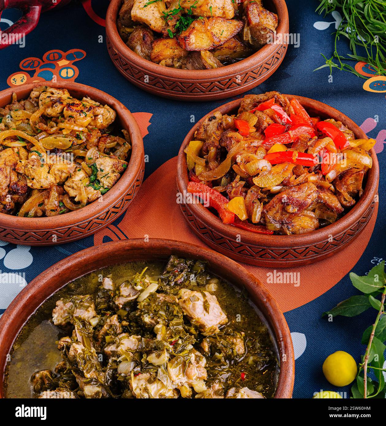 Colorful african cuisine with a variety of spicy stews in terracotta ...