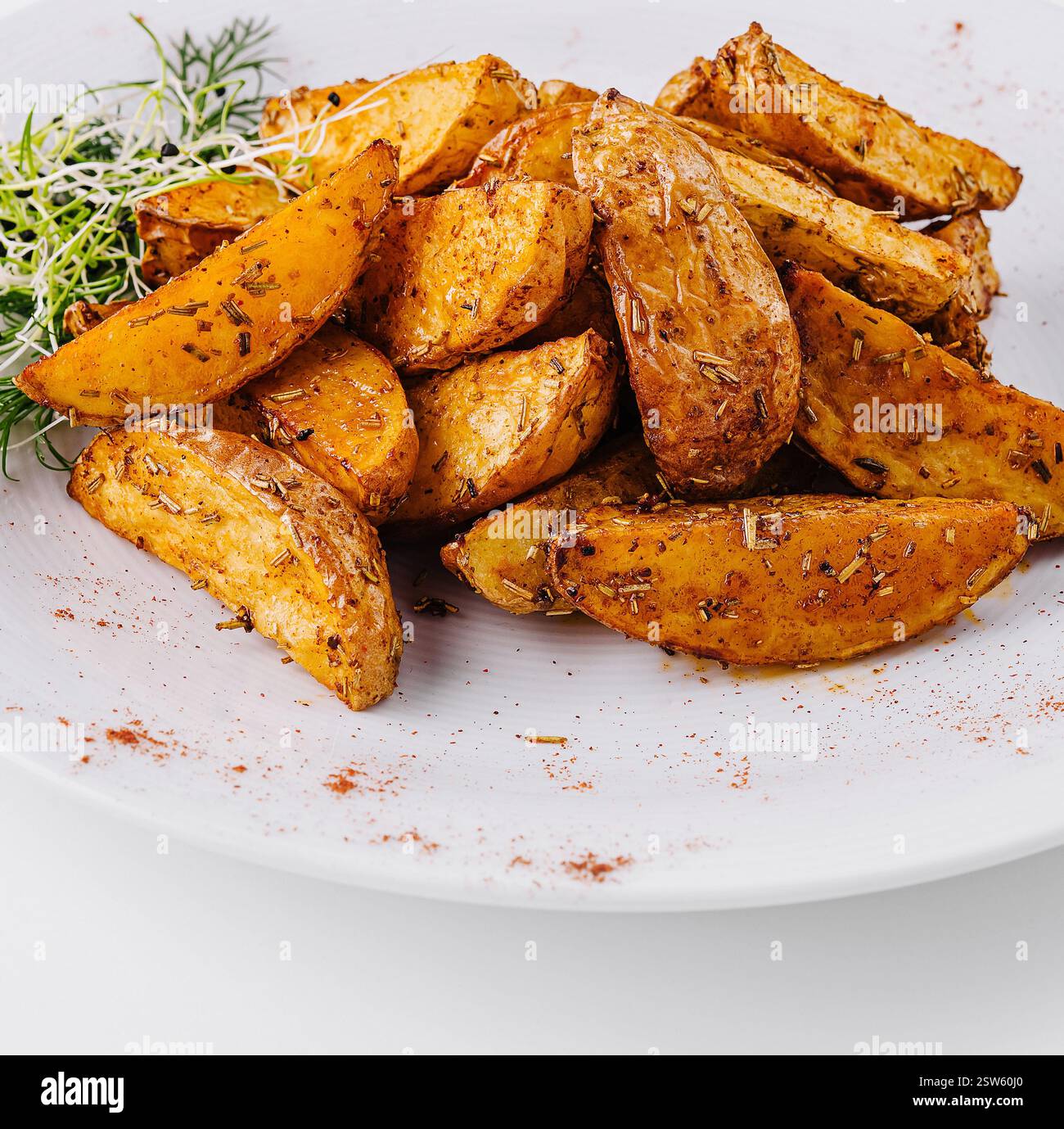 Plate seasoned roasted potatoes hi-res stock photography and images - Alamy