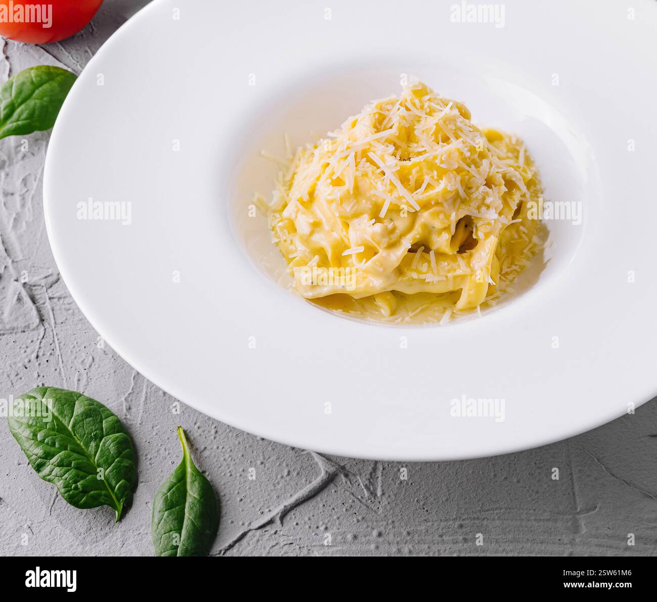 Gourmet italian pasta dishe on elegant table setting Stock Photo - Alamy