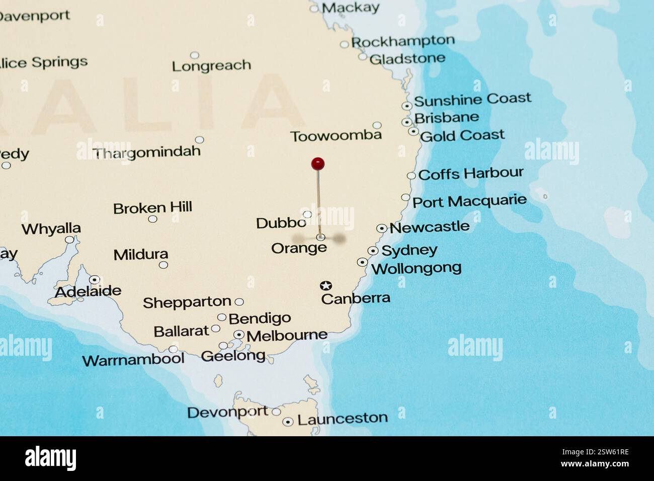 red pin needle into orange city of australia political map Stock Photo ...