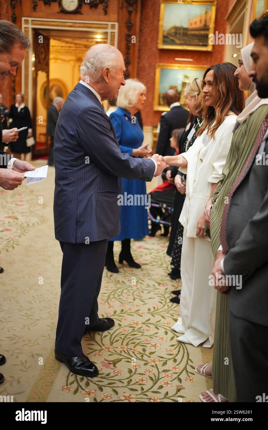 King Charles III shakes hands with Myleene Klass during a reception ...