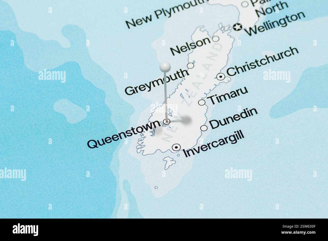 white pin needle into queenstown city of new zealand political map ...